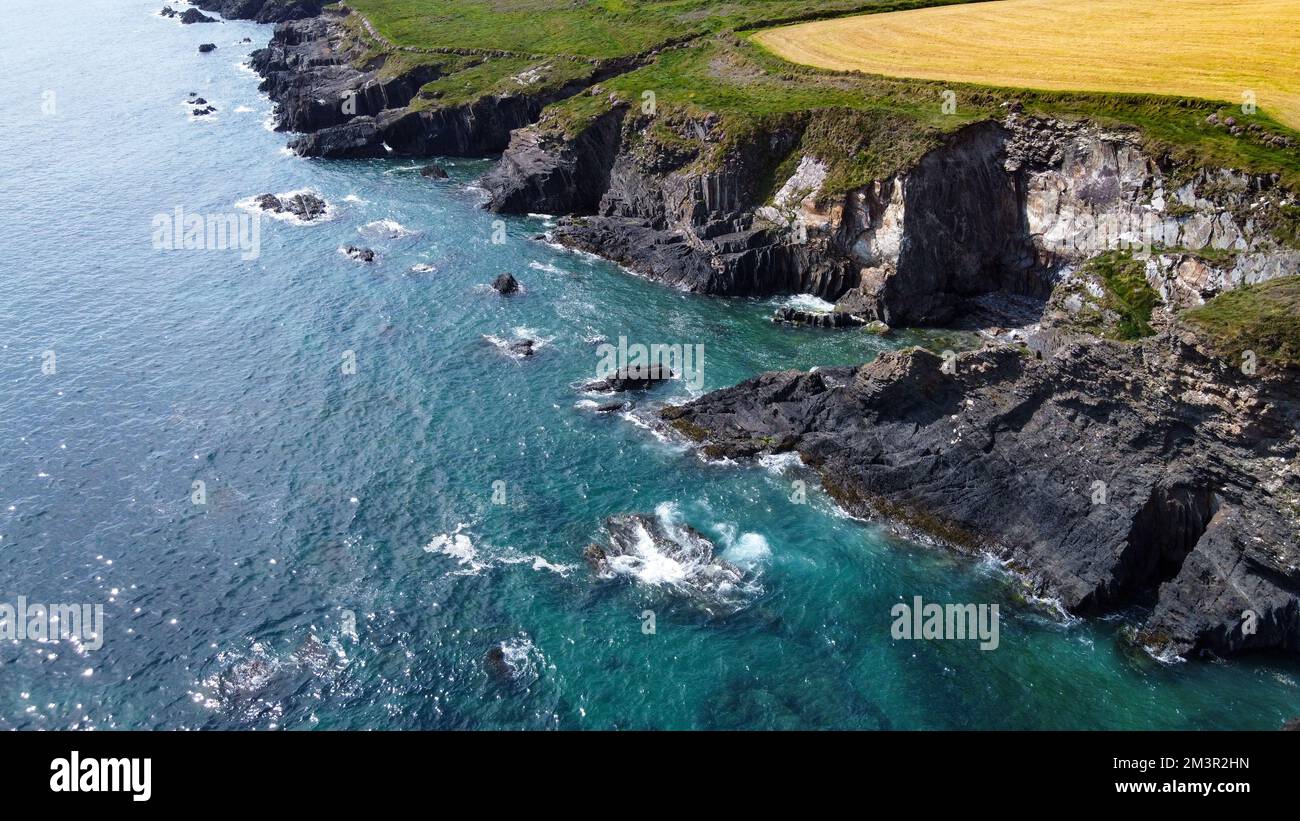 Seaside landscape of the south of Ireland. Picturesque coastal cliffs ...