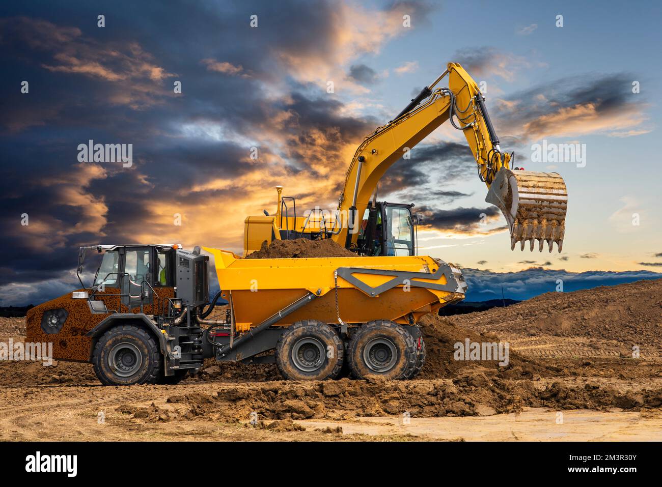excavator ist working and digging at construction site Stock Photo - Alamy
