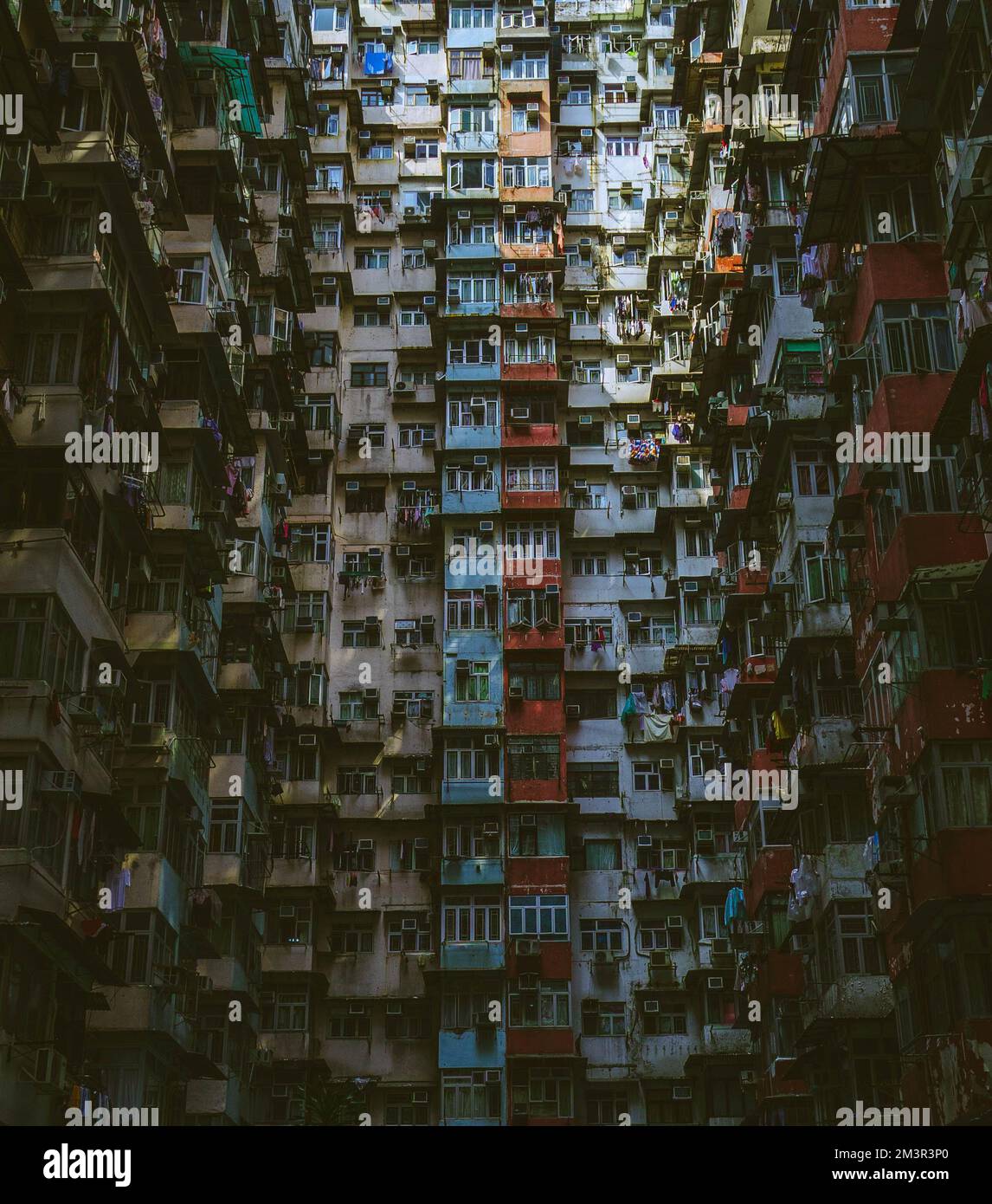 A vertical shot of the Yick Cheong apartment building with many dense ...
