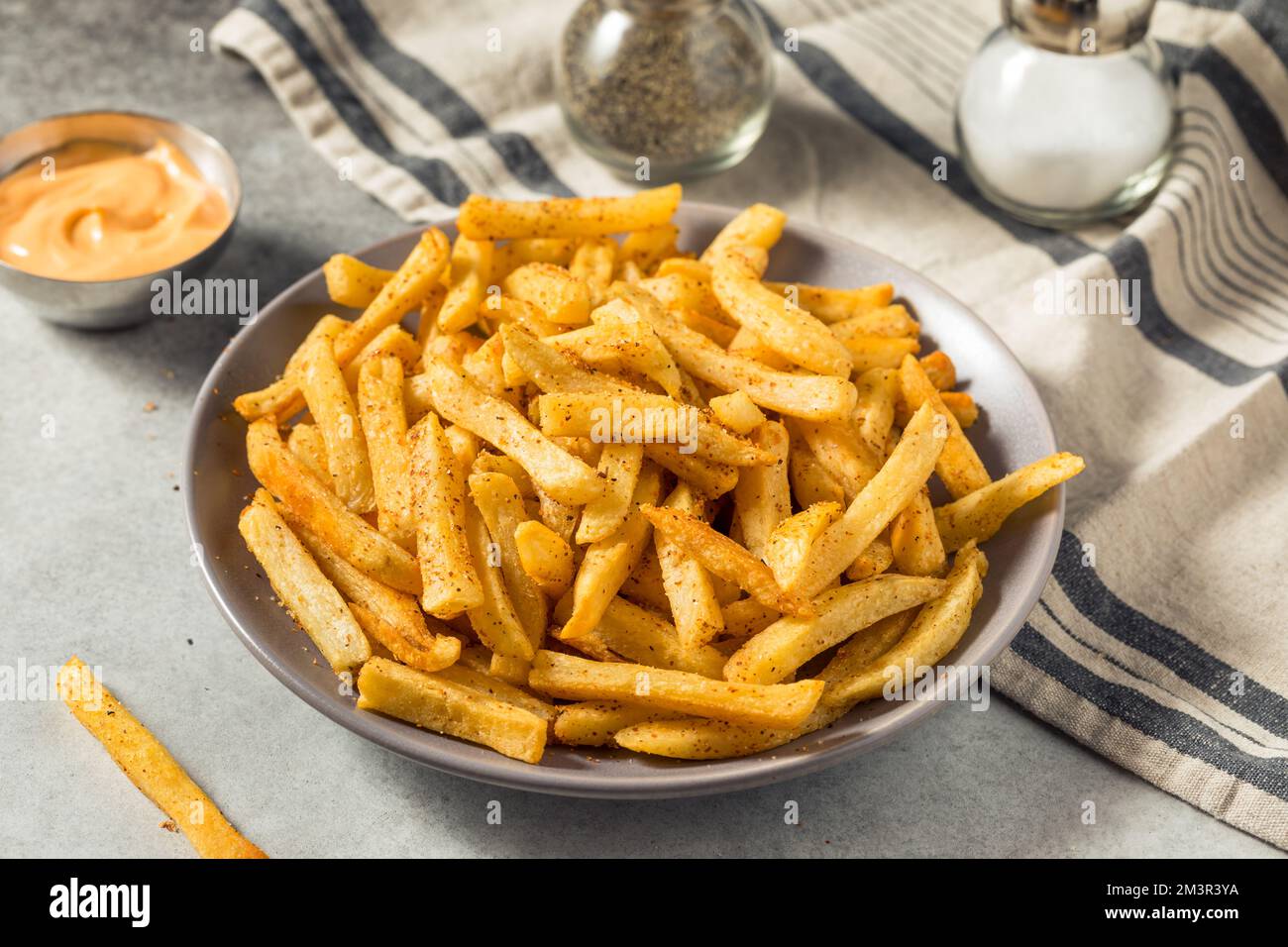 Homemade Spicy Cajun French Fries with Mayo Stock Photo - Alamy