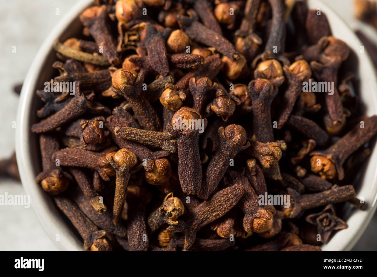 Raw Brown Organic Whole Cloves in a Bowl Stock Photo - Alamy