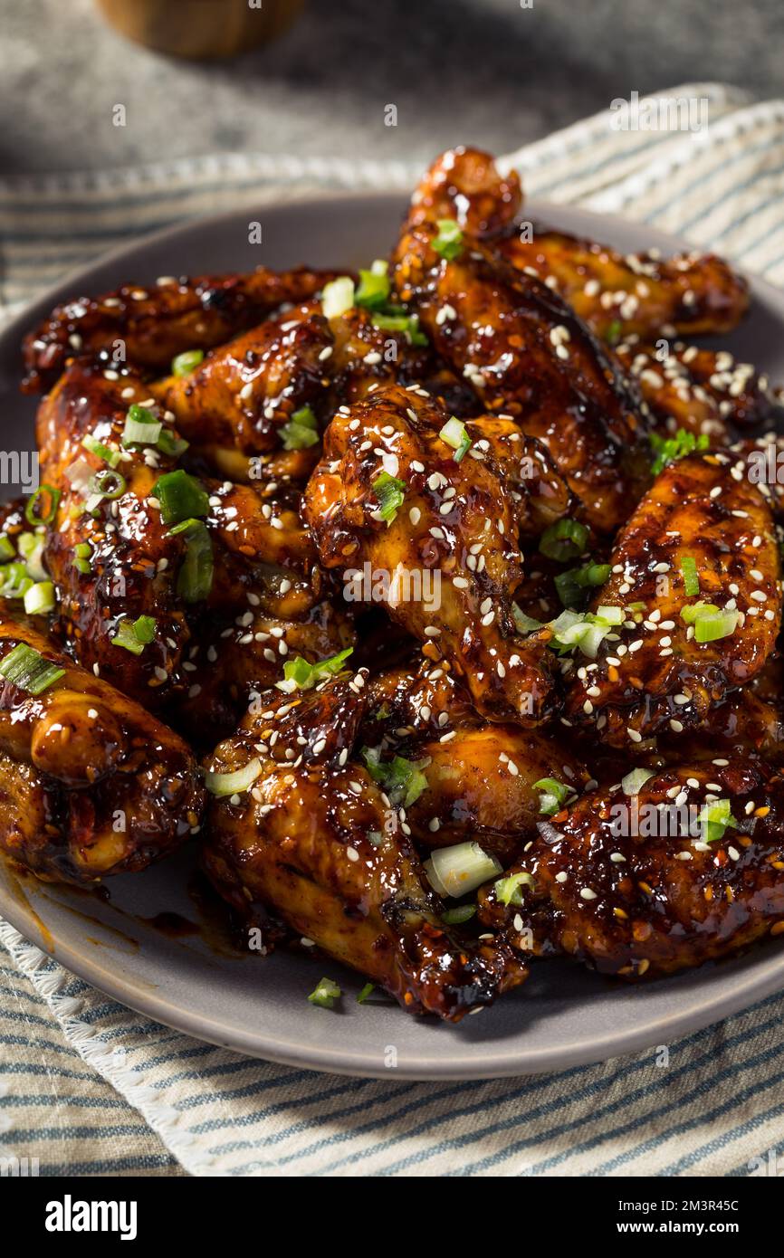 Homemade Asian Chili Crunch Chicken Wings with Sesame Seeds Stock Photo ...