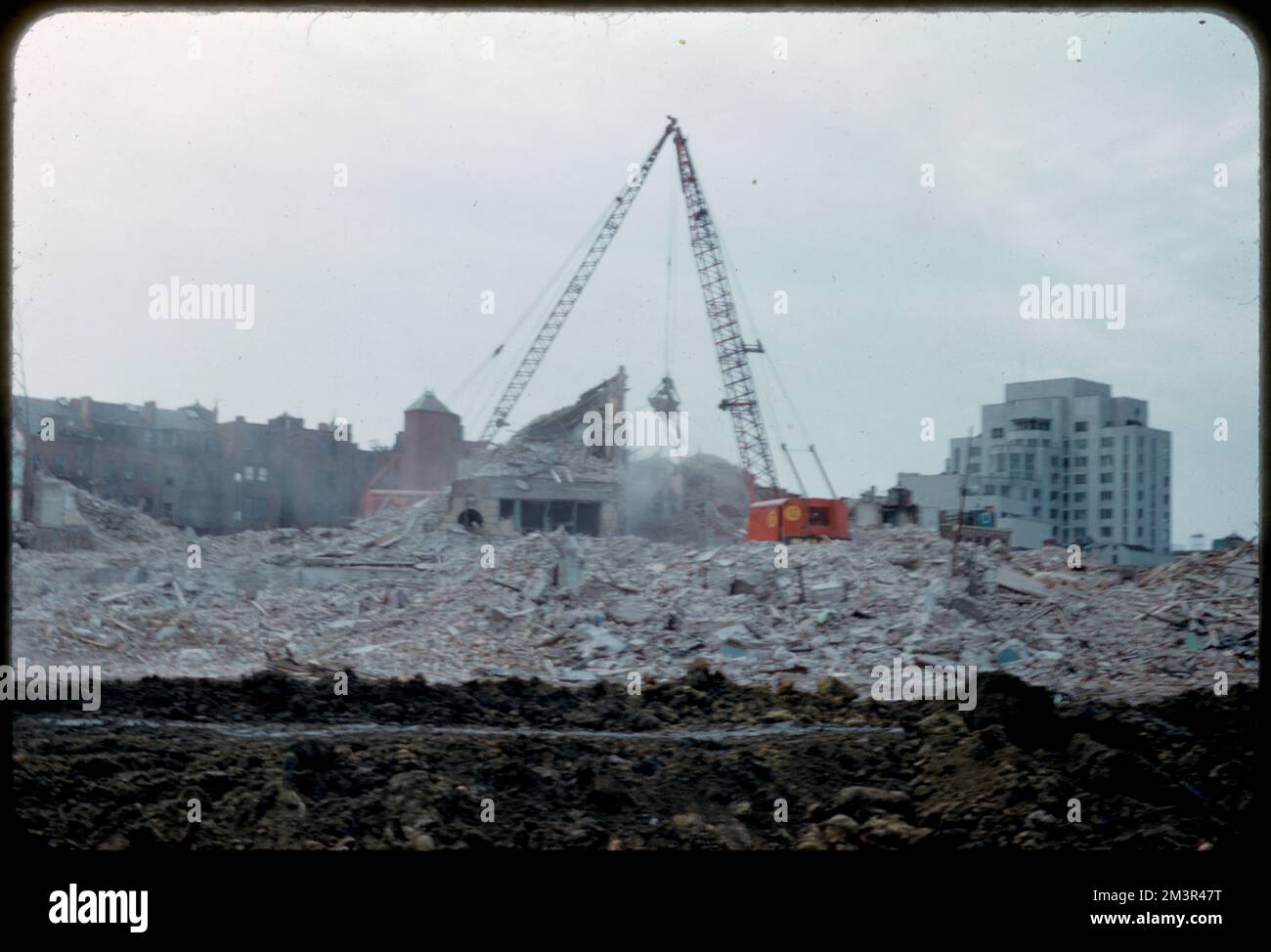 Rubble and crane in front of buildings, West End, Boston , Demolition ...