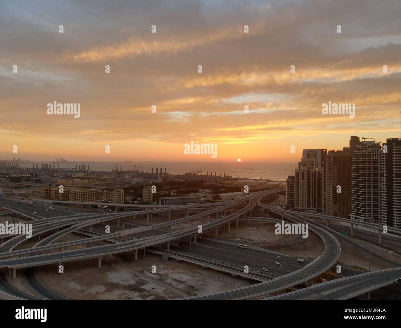 View of the new district of Dubai near the sea during sunset.Shooting ...