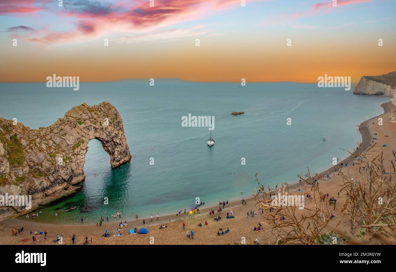 Durdle Door at Dorset in England, United Kingdom. people on the beach ...