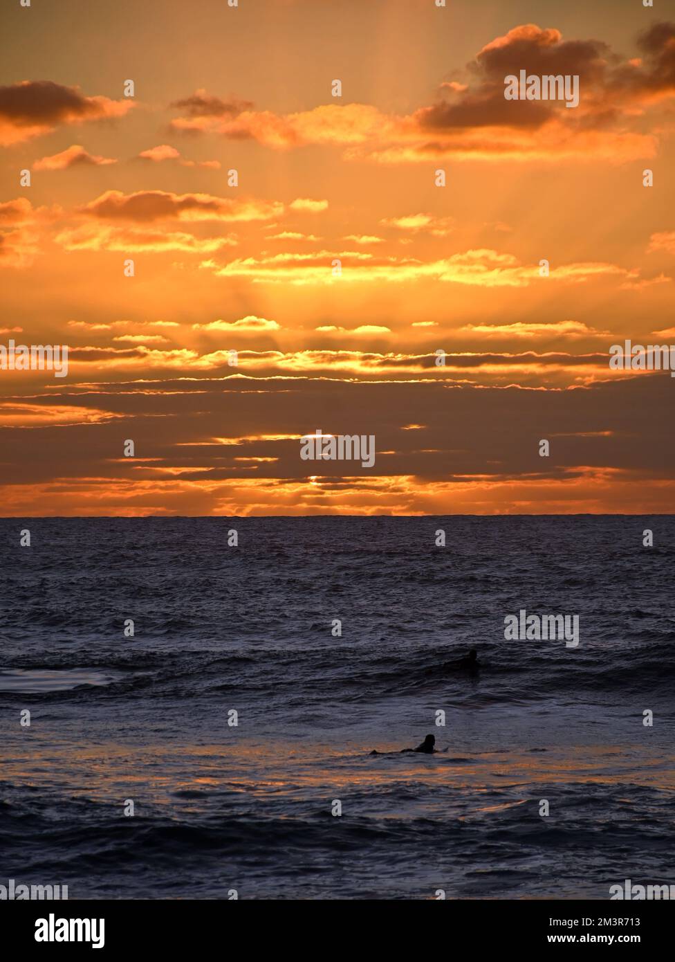 A picturesque view of the beautiful yellow-orange sunset sky with ...