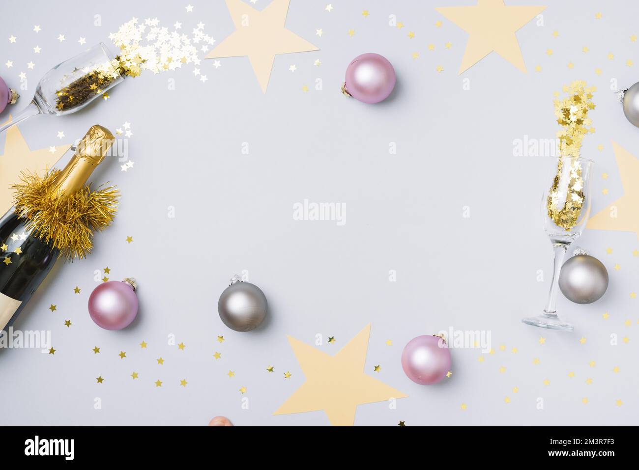 Champagne bottle with baubles table Stock Photo - Alamy