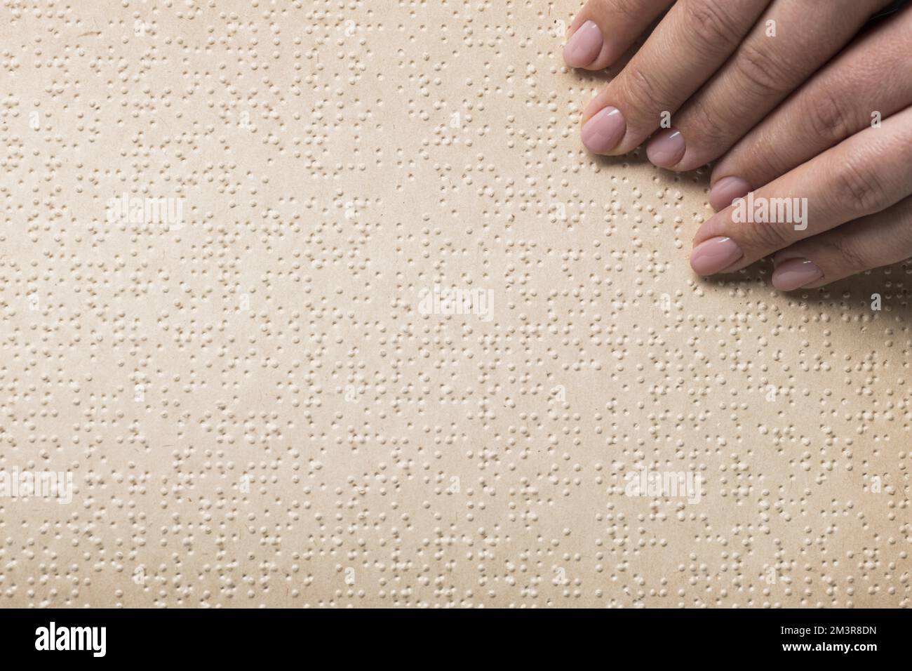Close up hands touching book Stock Photo - Alamy