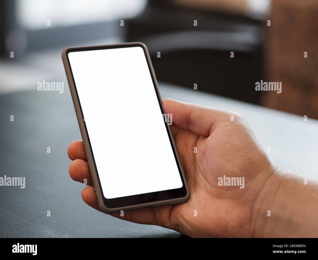Close up hand holding phone mock up Stock Photo - Alamy