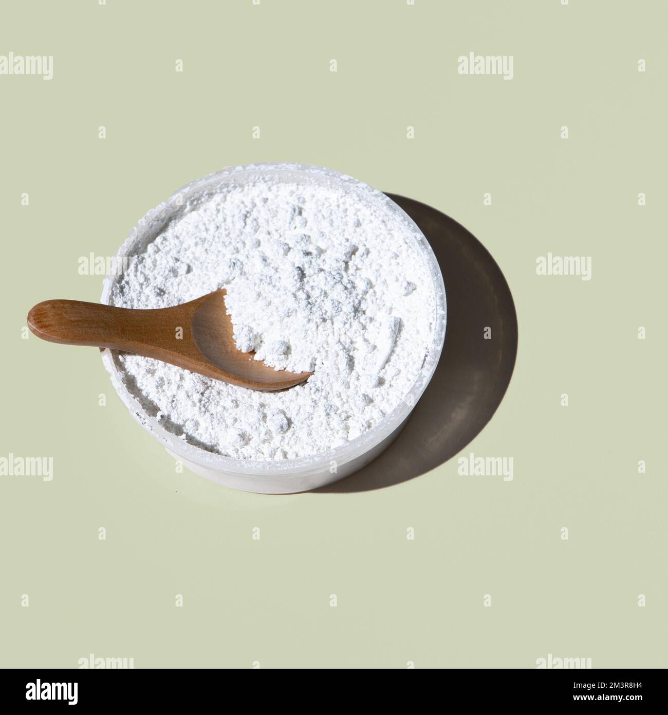 Close up powder bowl plain background Stock Photo - Alamy