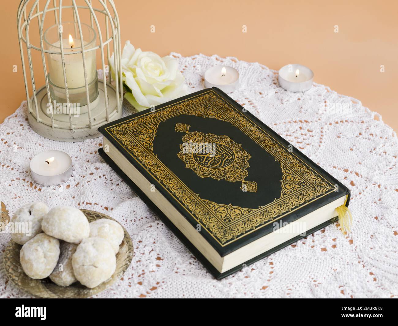 Close up quran table with pastries Stock Photo - Alamy