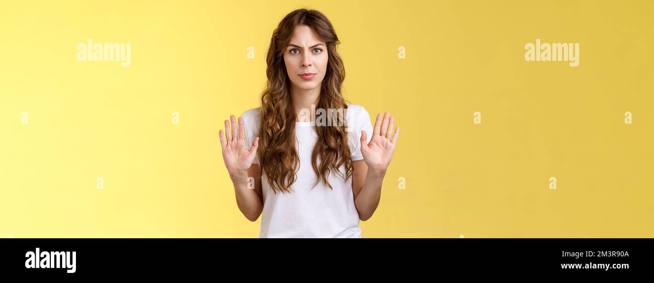 No thats enough. Serious-looking confident woman restrain man demand ...