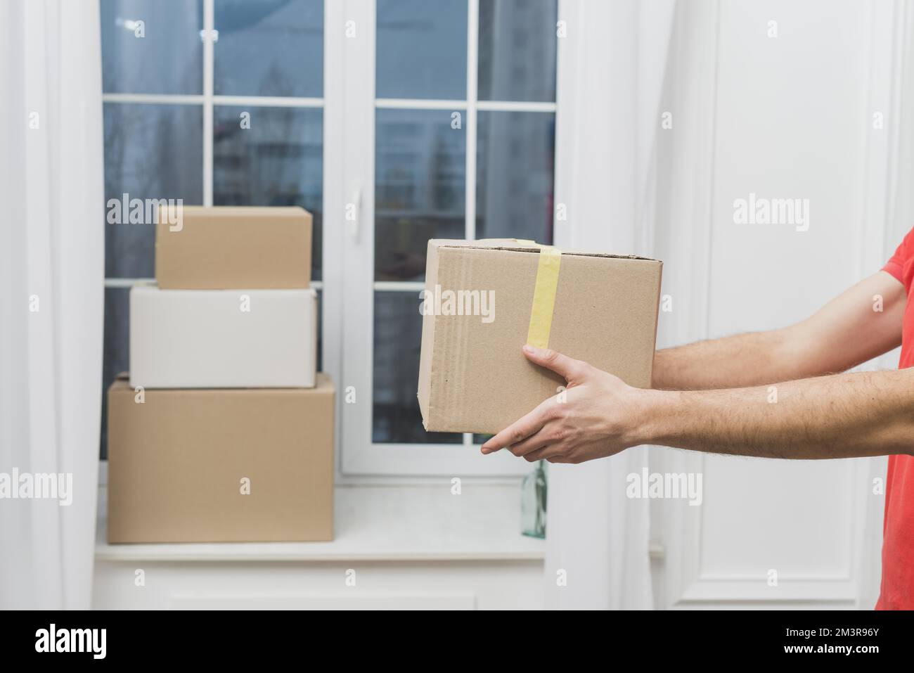 Crop hands with parcels Stock Photo - Alamy
