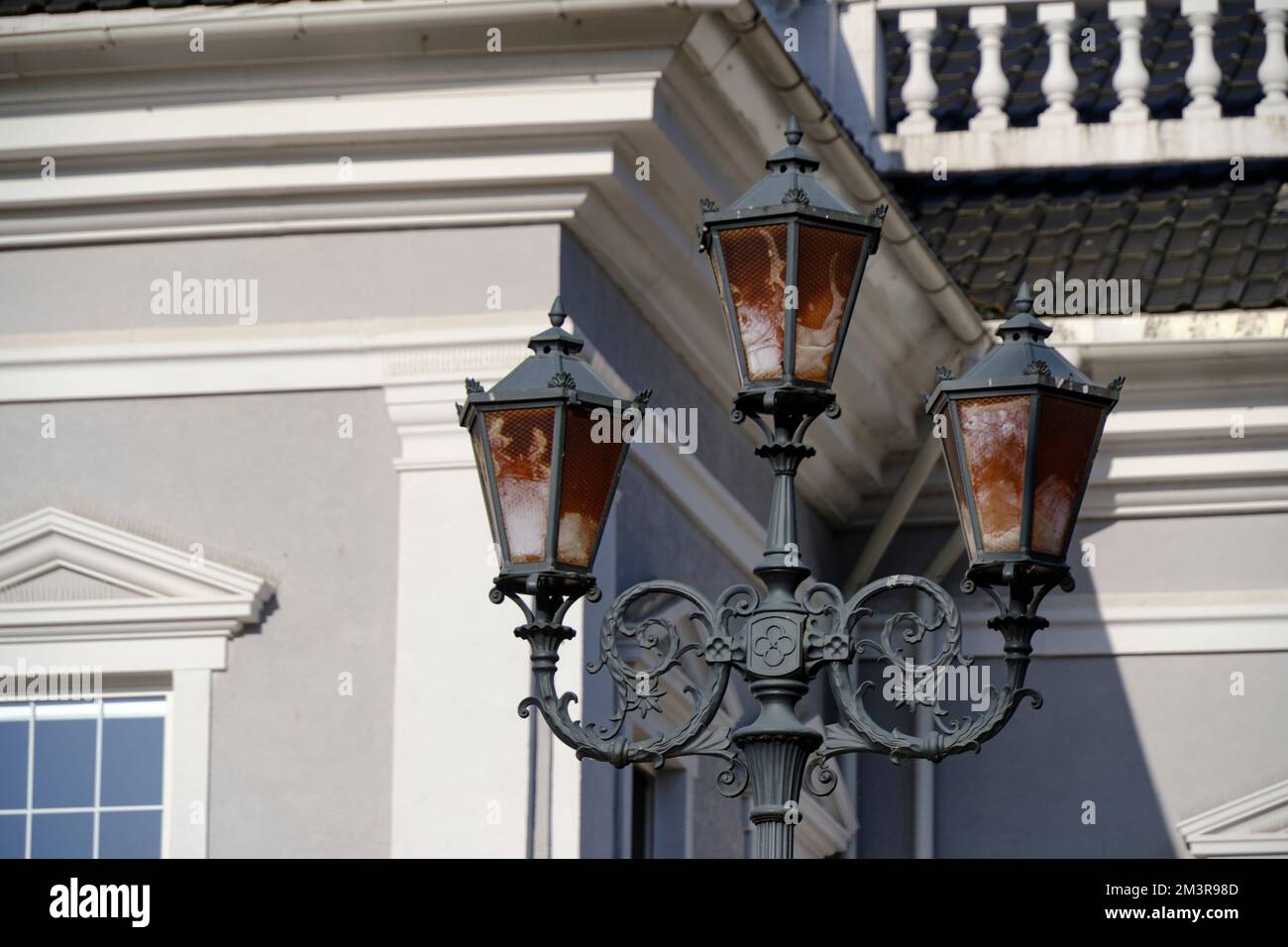 Old retro street lamp background historic building Stock Photo - Alamy
