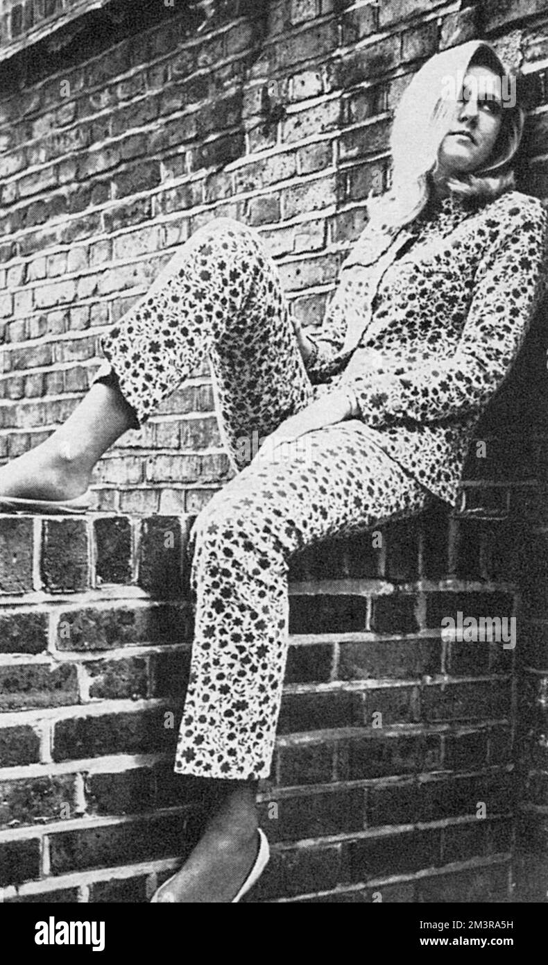 Pen Small wearing needlecord trouser suit from Clobber Stock Photo - Alamy