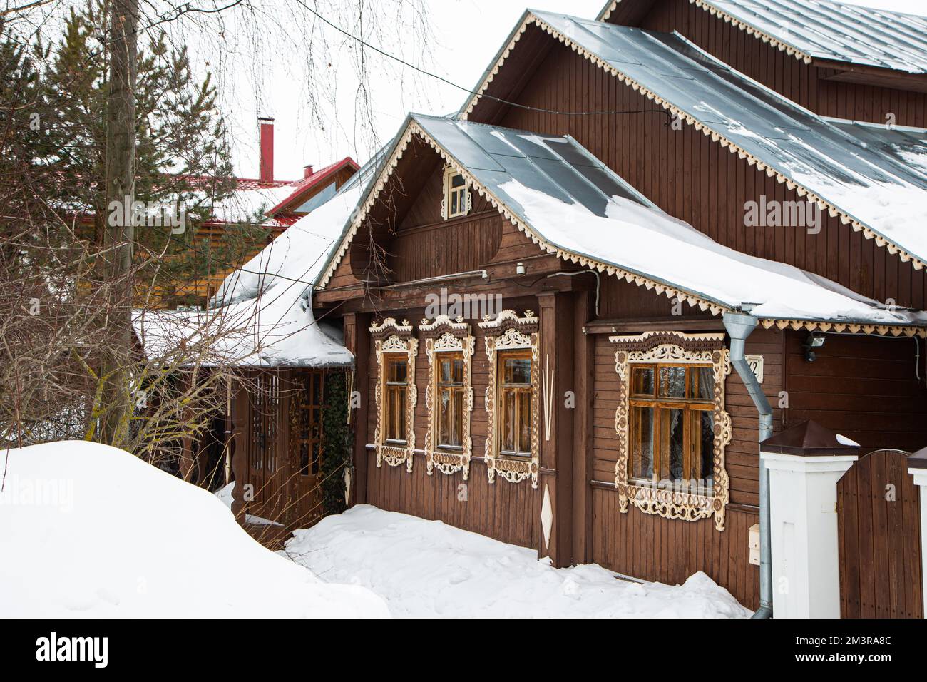 A Russian wood house covered in snow Stock Photo - Alamy