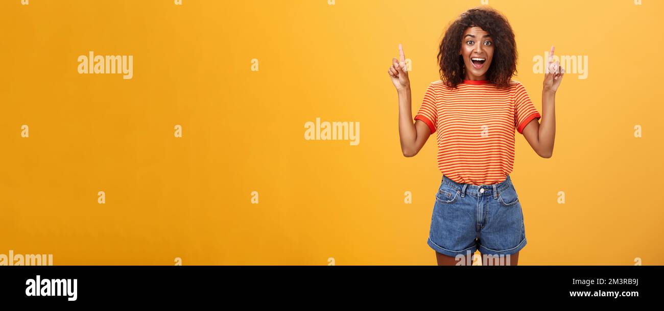Charmed and impressed african american stylish woman seeing incredible ...