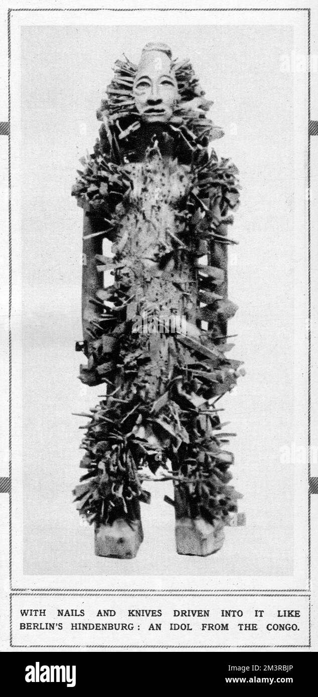 An idol from the Congo with knives and nails driven in to it. The ...