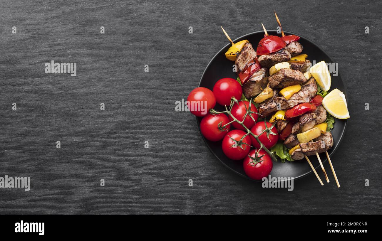 Top view delicious kebab with tomatoes copy space. Resolution and high ...