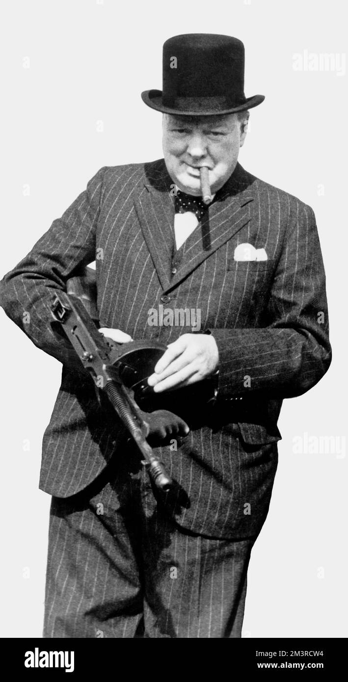Winston Churchill (1874-1965) - pictured holding a Sub-Machine Gun ...