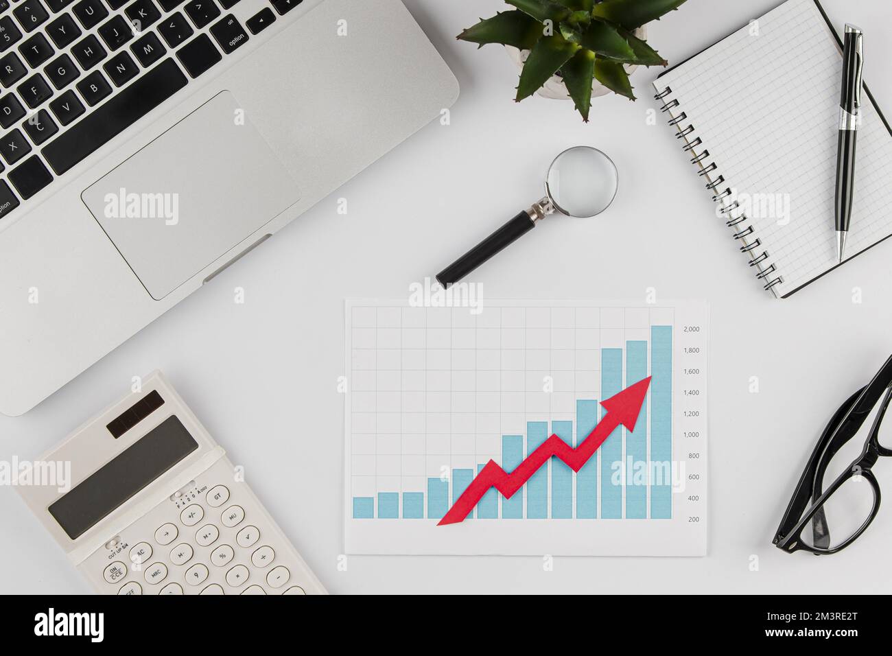 Top view office desk with growth chart laptop. Resolution and high ...