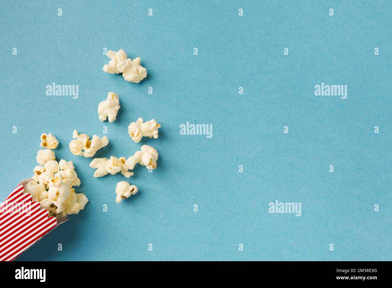 Top view popcorn composition blue background with copy space ...