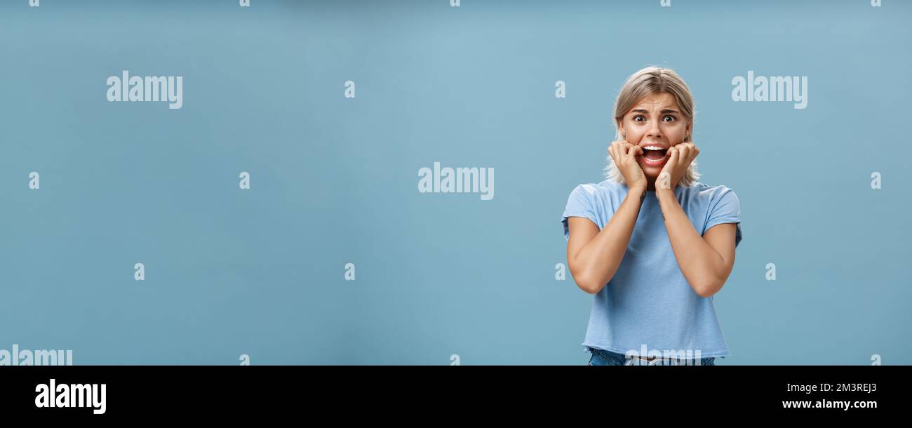 Indoor shot of shocked troubled girlfriend hearing mom returned home ...