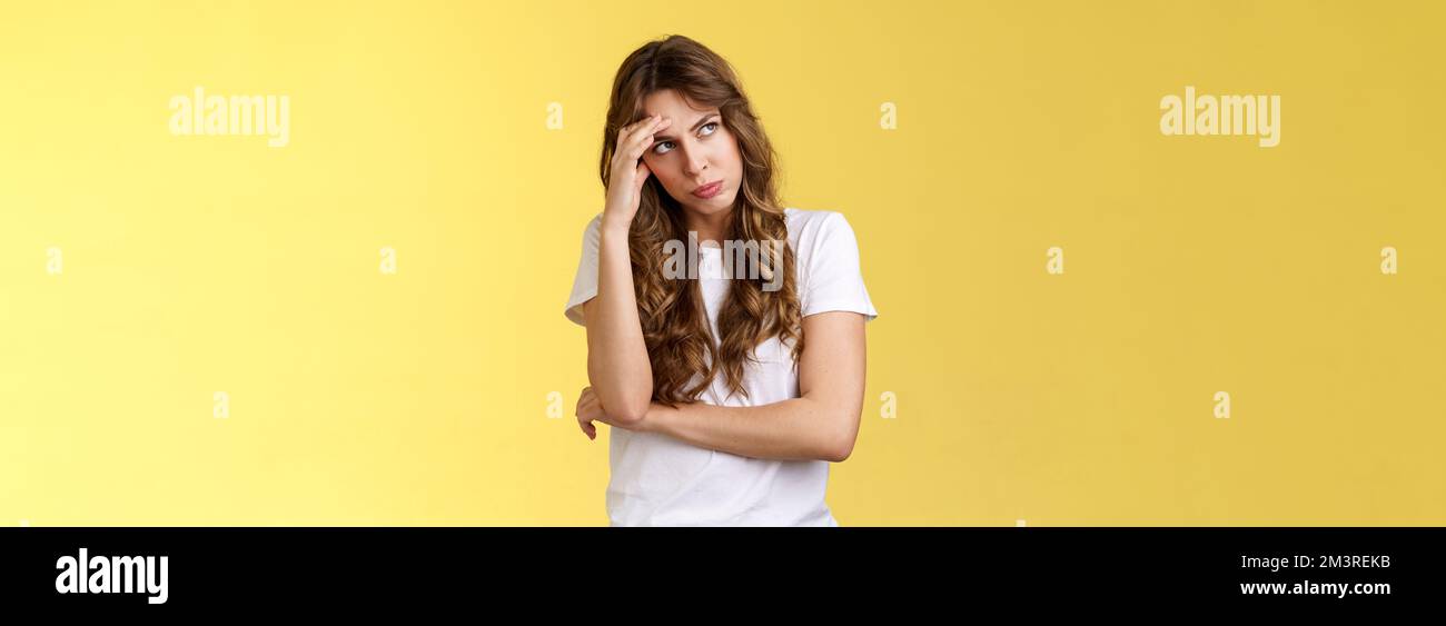 Gosh what nuisance. Embarrassed annoyed young ignorant displeased woman ...