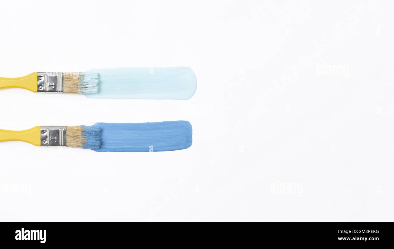 Top view yellow brushes with blue paint. Resolution and high quality ...