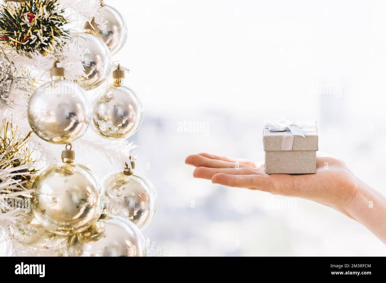 Woman holding small gift box hand. Resolution and high quality ...