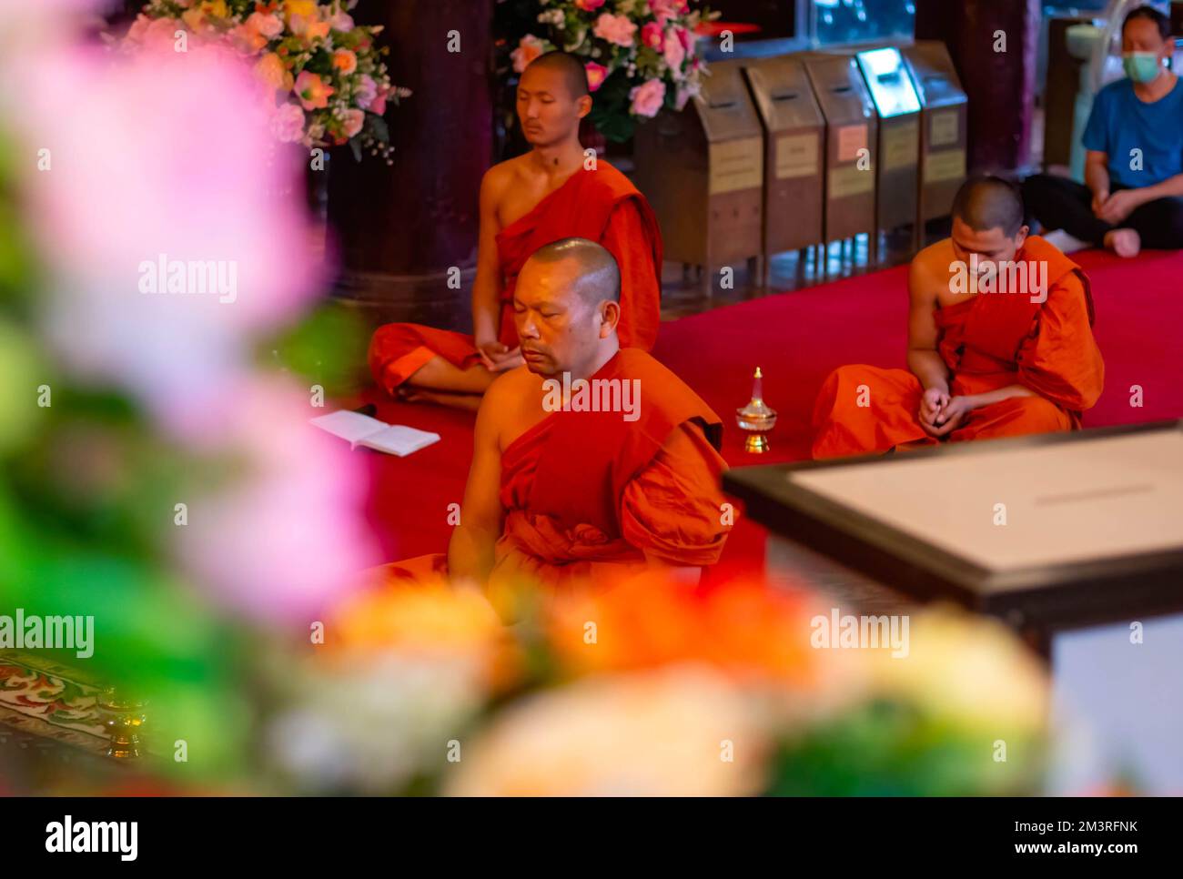 Thai Buddhist monks with well-wishers attend a prayer session to bless ...