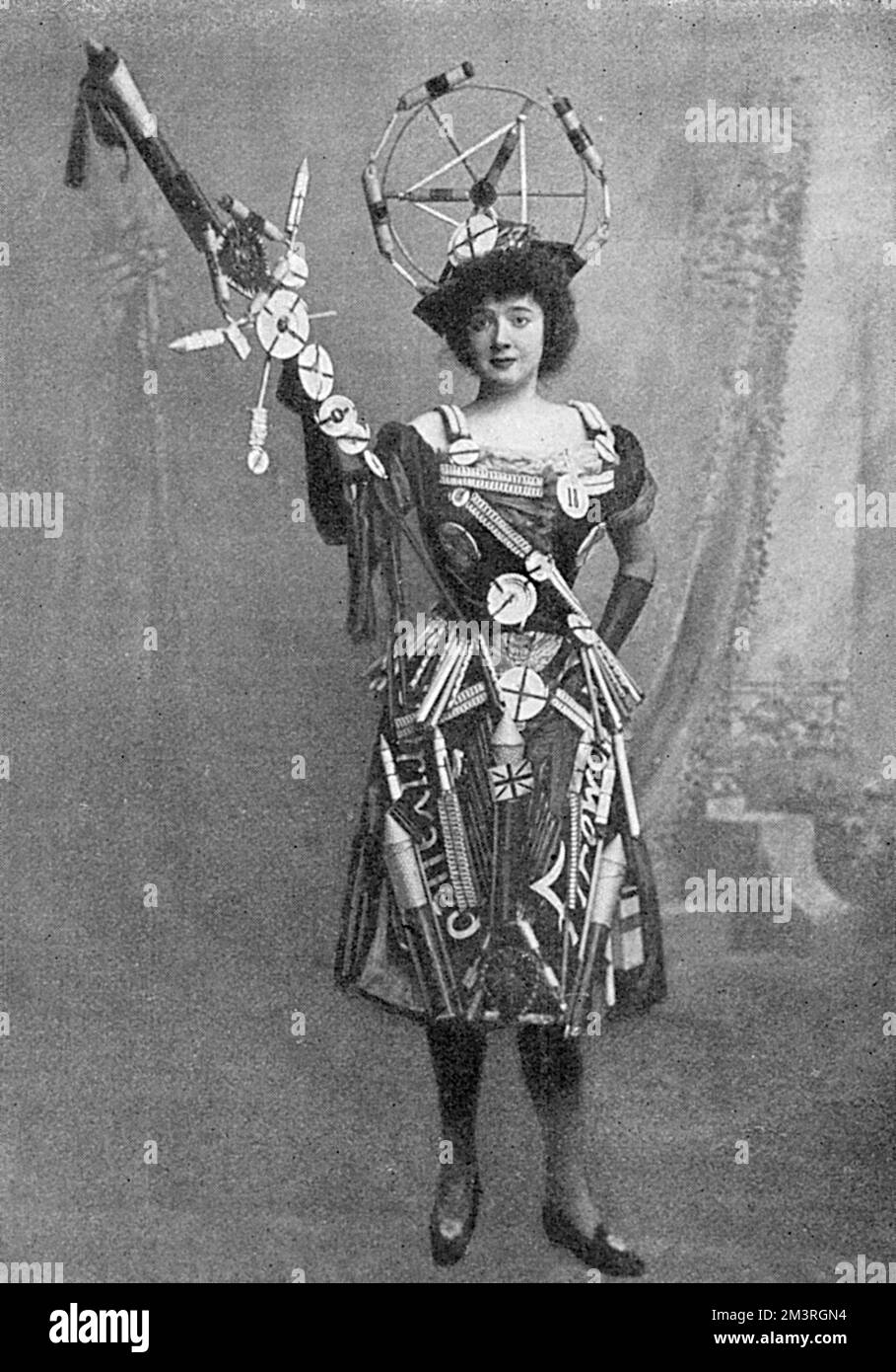 Fancy Dress - Miss Dora Langroyd as Fireworks Stock Photo - Alamy