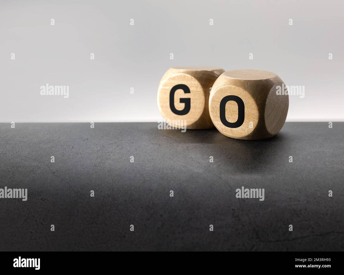 "go" text made of wooden cube Stock Photo - Alamy
