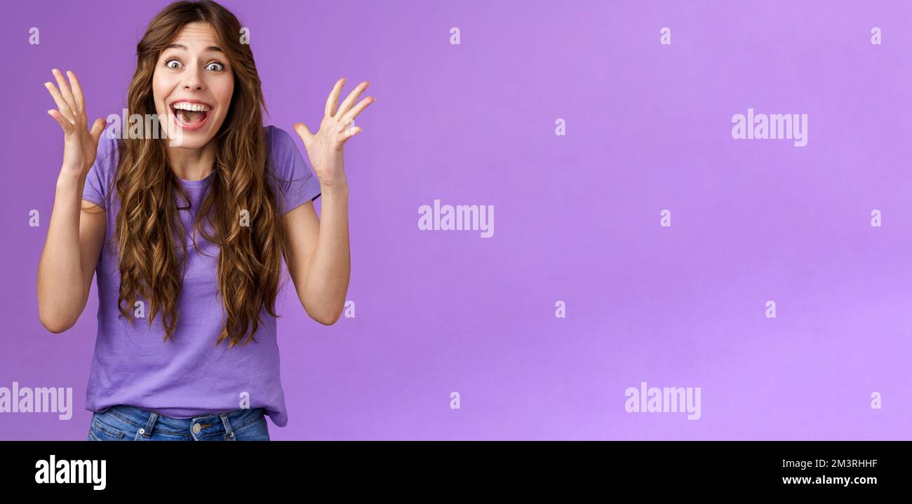 Cheerful surprised happy girl receive unbelievable super prize winning ...