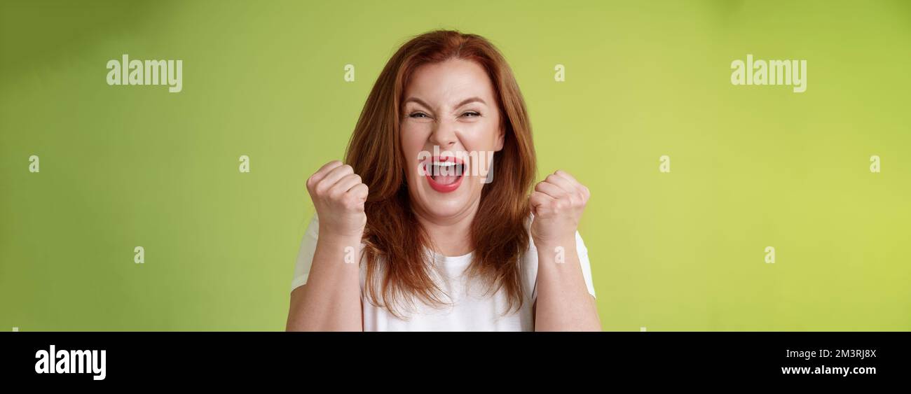 Yeah we did it. Joyful lucky redhead middle-aged female winner pump ...