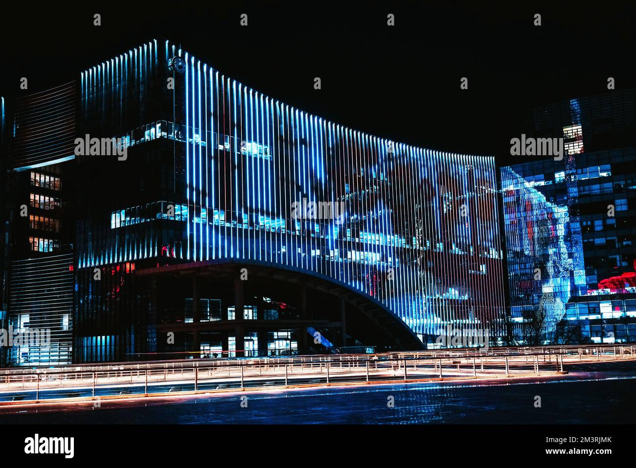 A beautiful night view of buildings, illuminated with blue lights in ...