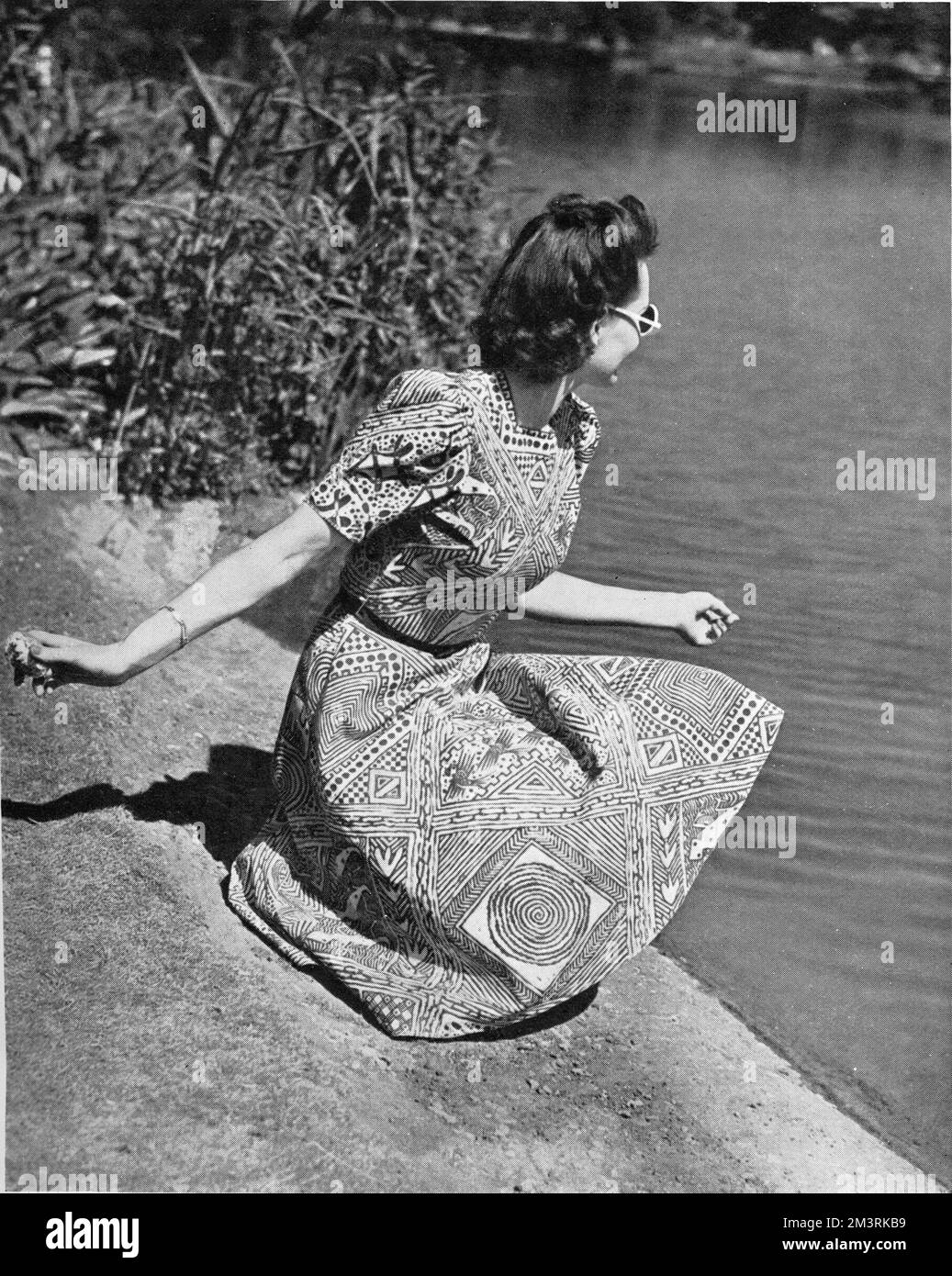 Woman poses in square-necked summer frock, designed by Walpole, New ...
