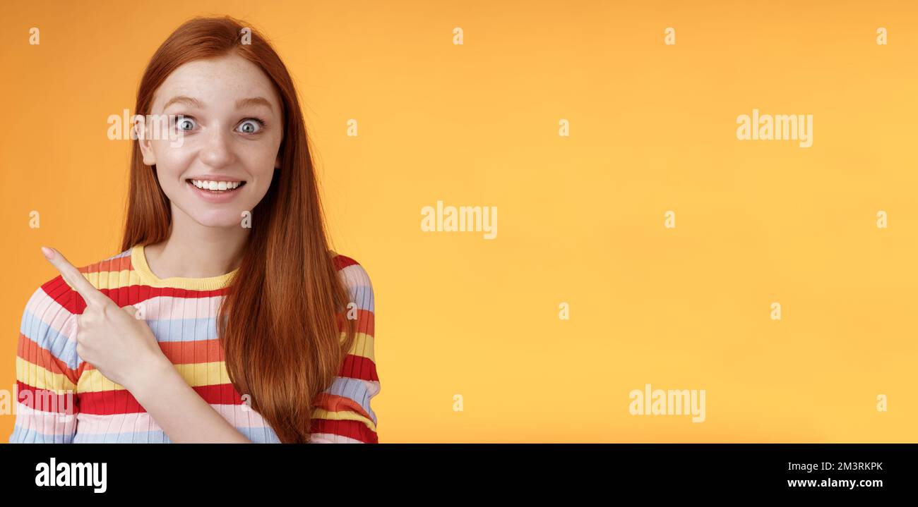 Excited thrilled good-looking young silly redhead girl surprised pop ...