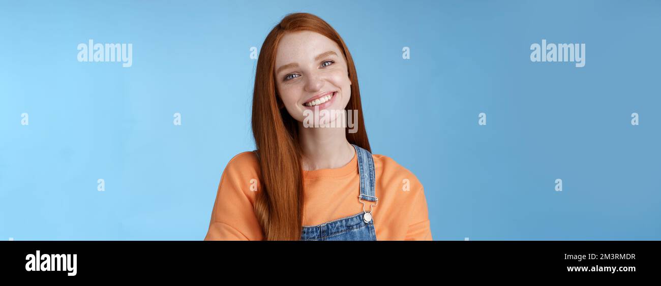 Charismatic kind pleasant redhead girl blue eyes smiling friendly ...
