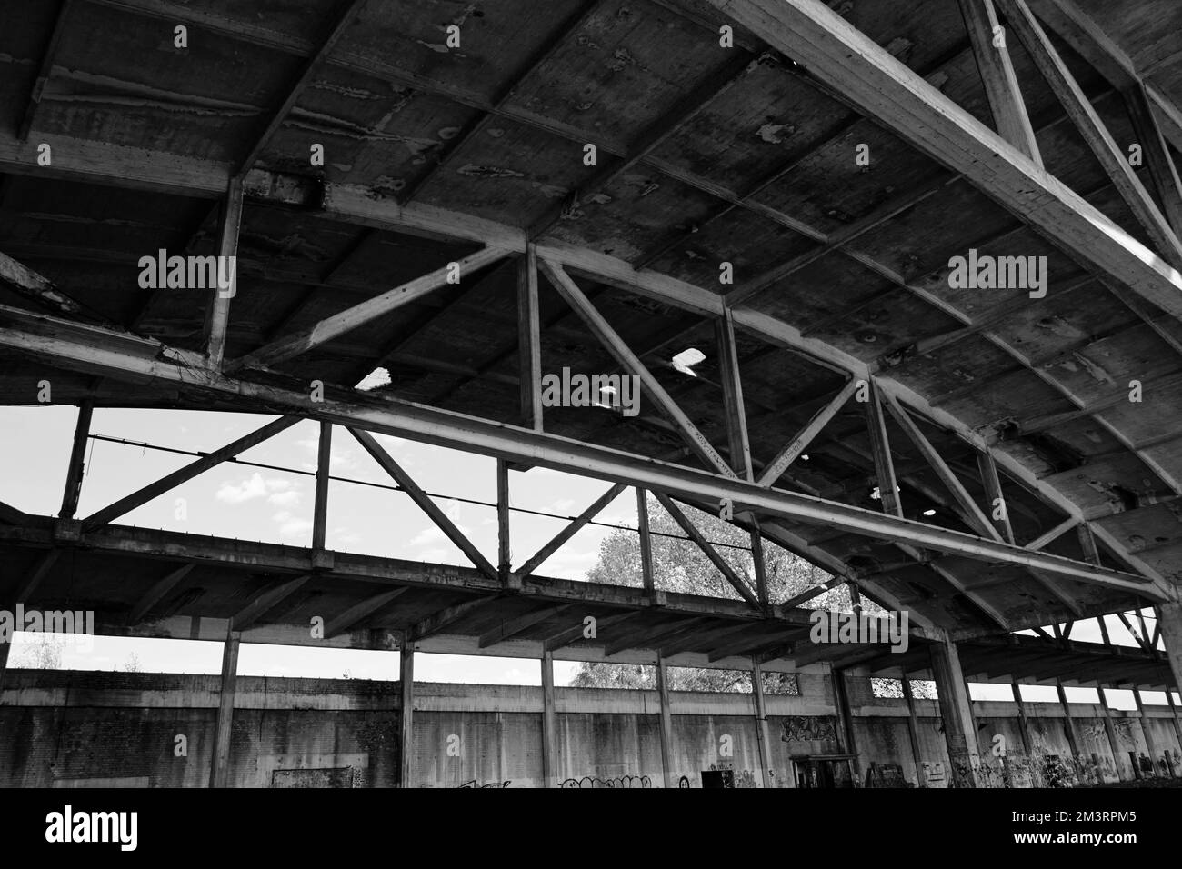Old arched metal structures abandoned air hangar Stock Photo - Alamy