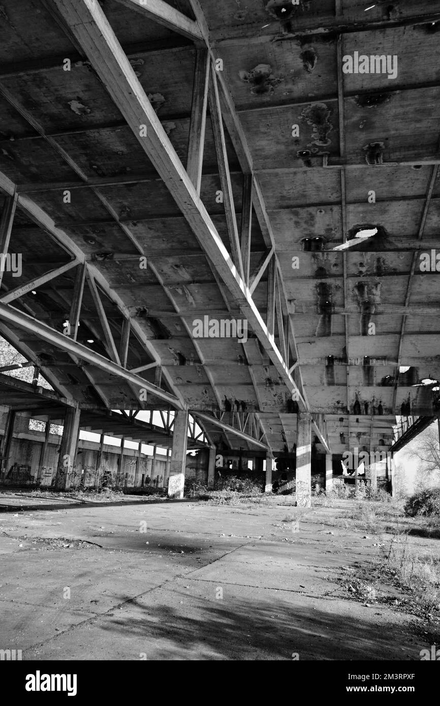 Old arched metal structures abandoned air hangar Stock Photo - Alamy