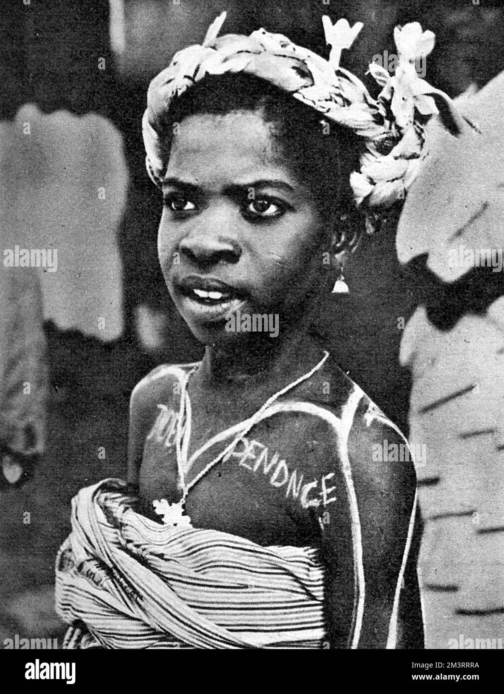 A little Ghanaian girl with 'independence' painted across her chest ...