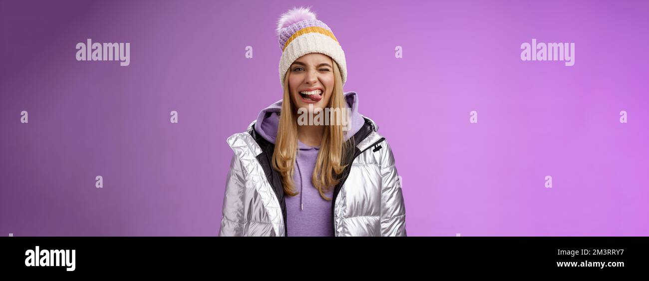 Cheeky carefree delighted charming blond girl having fun feel amused ...