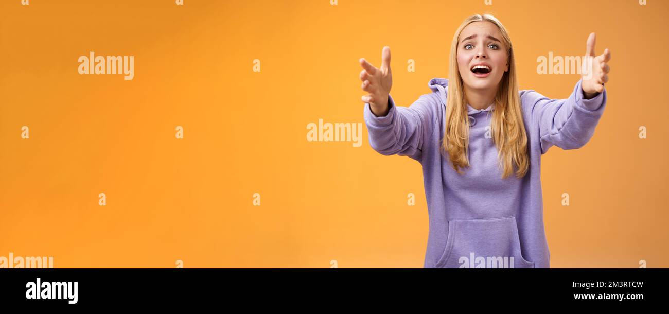 Excited fascinated glad blond woman adore singer performing stage ...