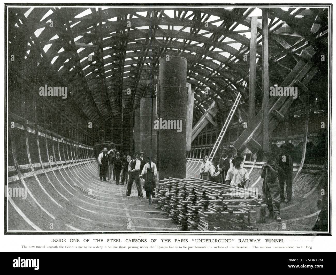 Workers inside one of the steel caissons of the extension to the Paris ...