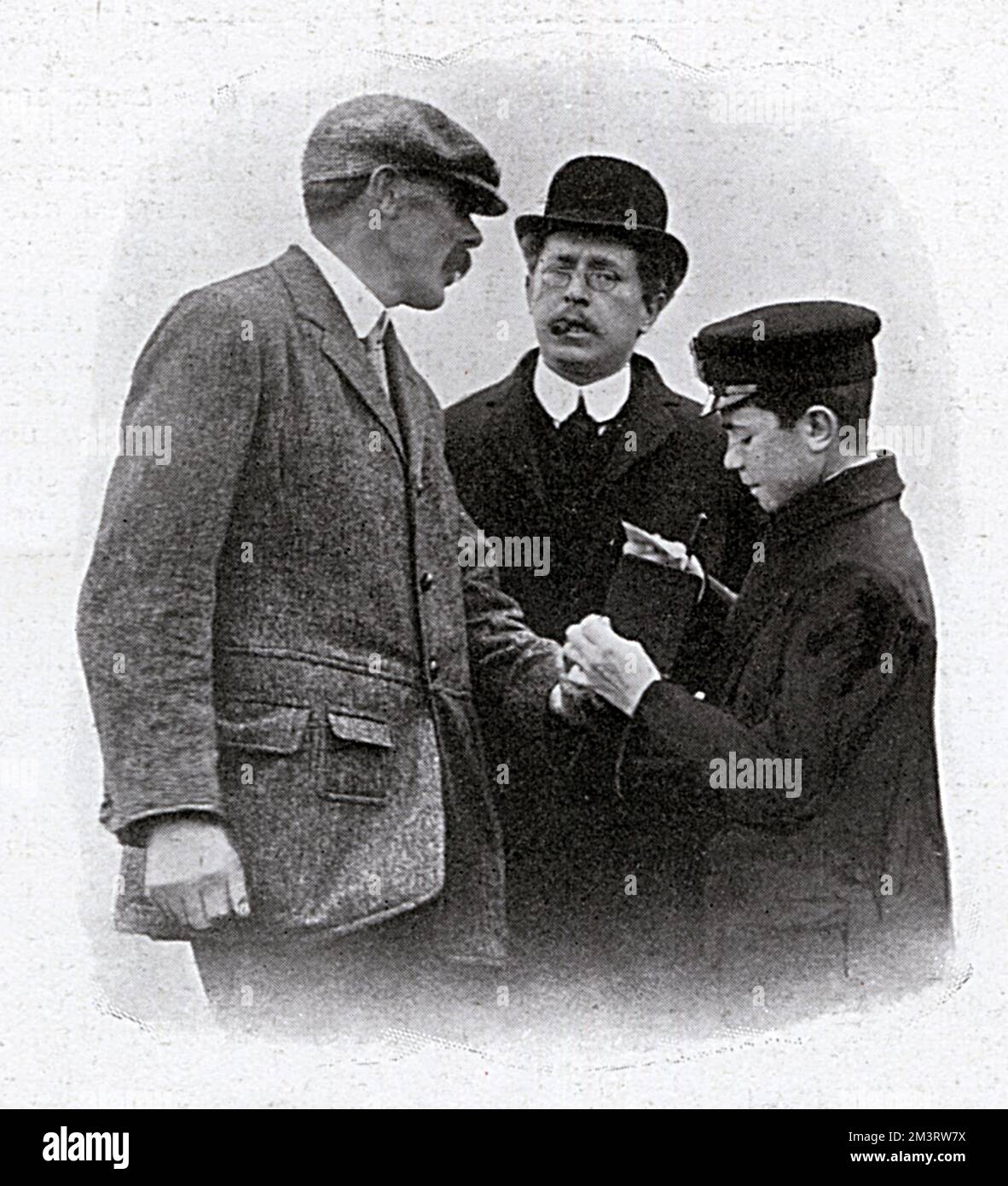 Golfer James Braid signing an autograph for a young hunter at Banstead ...