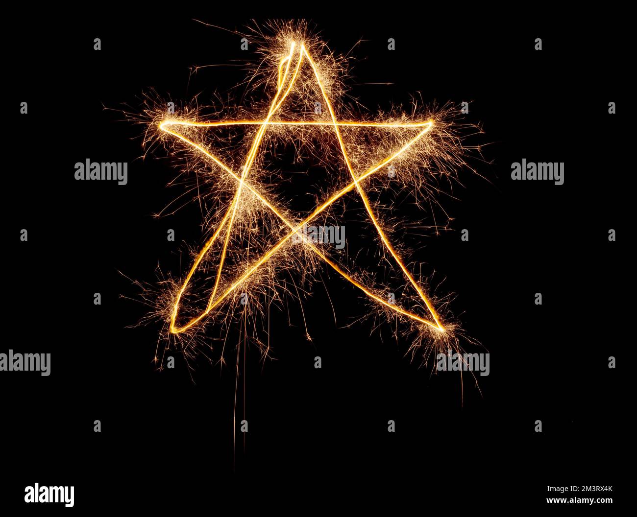 Star from firework sparks on a black background Stock Photo - Alamy
