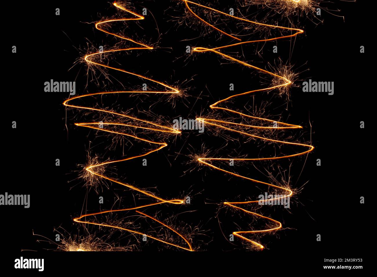 Lines and sparks of fireworks on a black background Stock Photo - Alamy