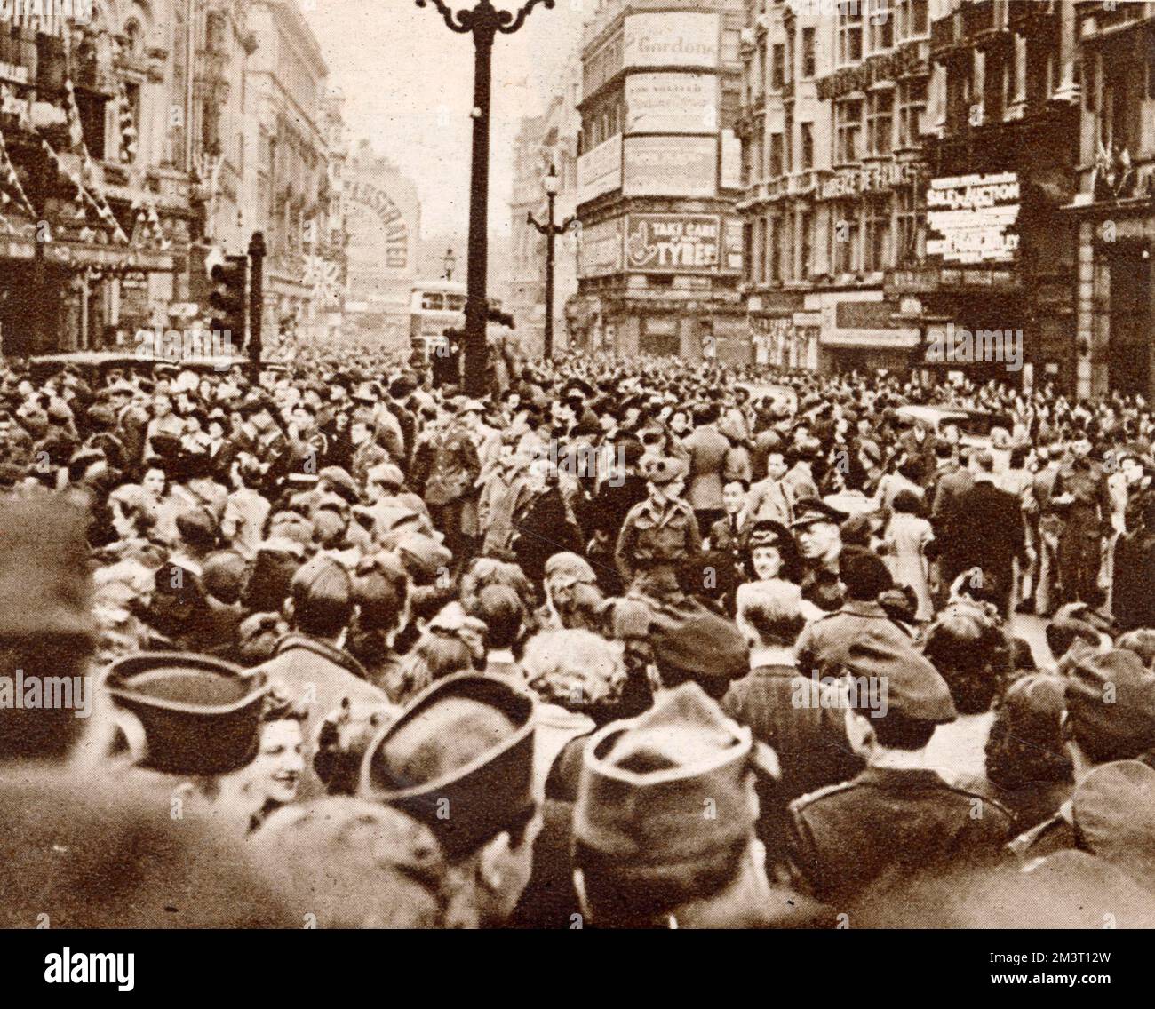 Crowds congregating in Piccadilly Circus, one of the focal points of ...