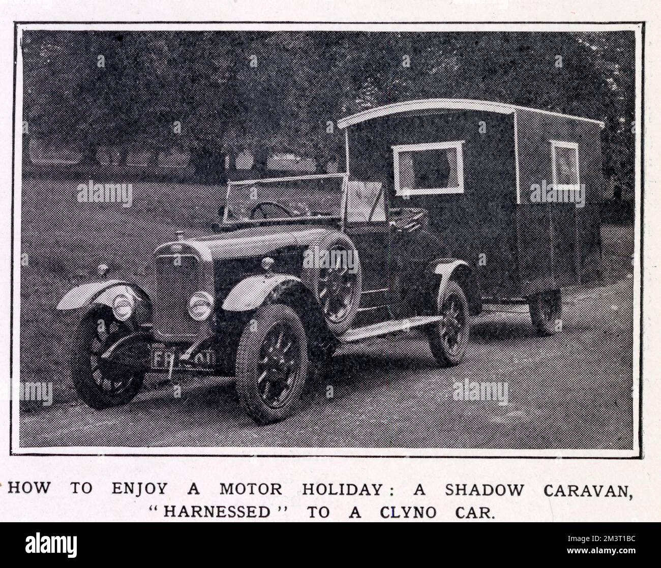 A Shadow Caravan (open), harnessed to a Clyno Car Stock Photo - Alamy